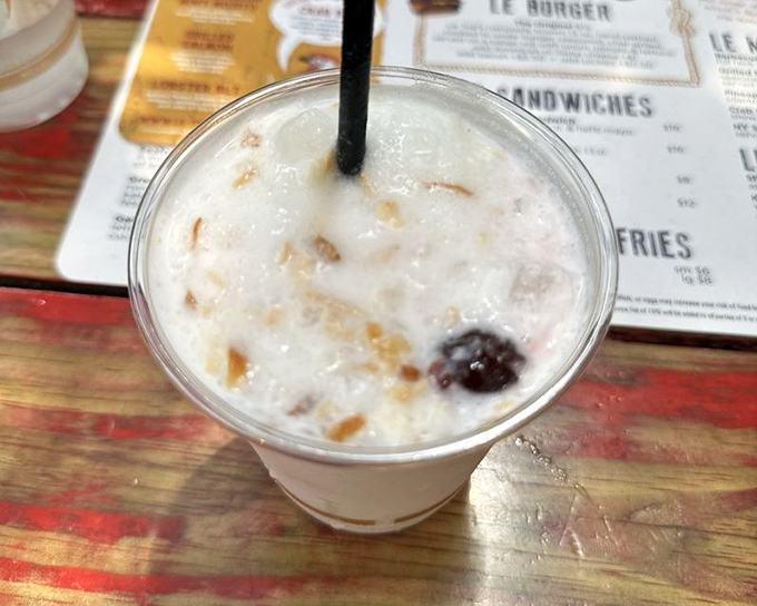 This pi&ntilde;a colada isn't just a drink &ndash; it's a vacation in a plastic cup, where coconut and pineapple transport you to island time with every sip.