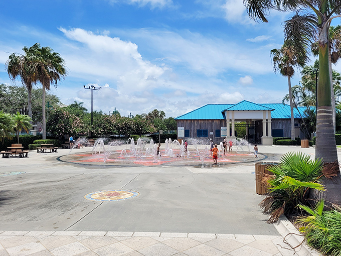 Children dance through cooling jets at Royal Palm Pointe Park's interactive fountain, the perfect antidote to Florida's famous sunshine.