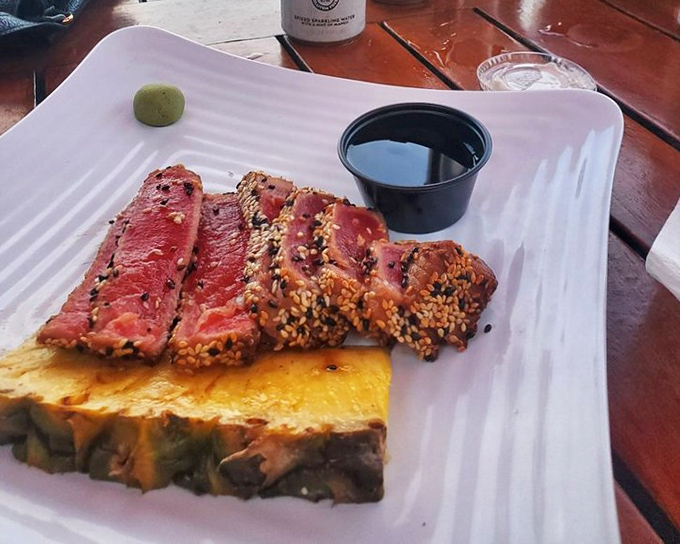 Seared tuna, pink in the center and sesame-crusted outside, served with pineapple &ndash; proof that art can indeed be delicious.