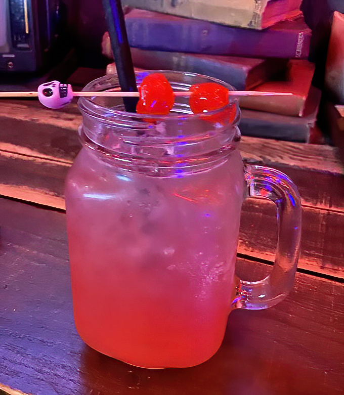 This crimson elixir served in a mason jar isn't just a drink &ndash; it's liquid courage for battling the wasteland, complete with cherry power-ups.