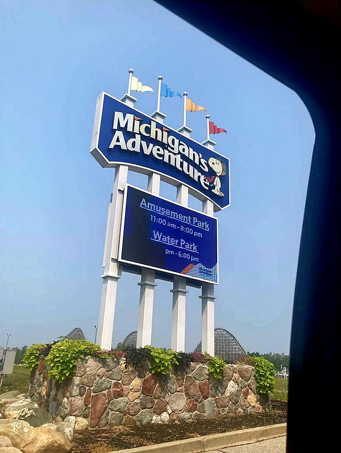 The park's entrance sign welcomes visitors with Snoopy's cheerful face, promising adventures that will become next year's "remember when" stories.