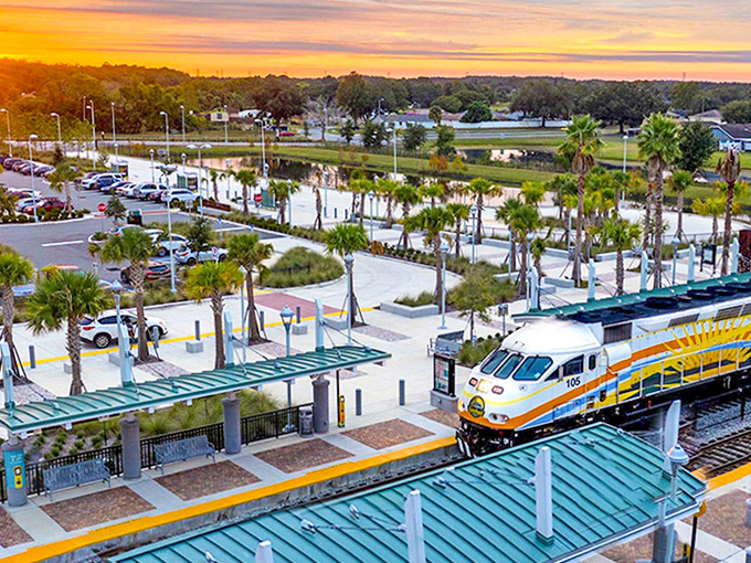 Sunset casts a golden glow across the platform as the evening train arrives, palm trees standing sentinel like a quintessential Florida postcard.