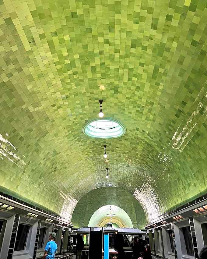 The mesmerizing green-tiled ceiling creates an underwater atmosphere so convincing, you might catch yourself holding your breath.