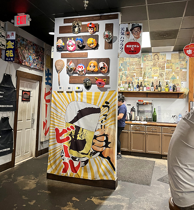 Vintage posters and character masks bring bold pops of Japanese pop culture to the walls.