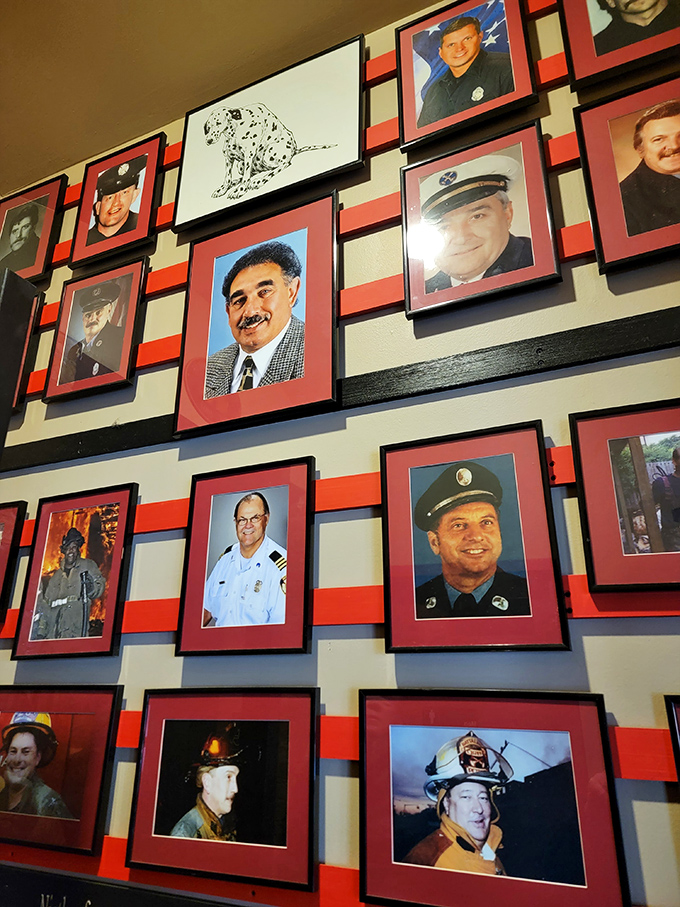 A wall of honor displaying firefighter portraits&mdash;a respectful tribute that reminds diners of the building's noble heritage.