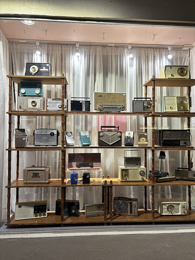 A museum-worthy display of vintage radios stands ready to broadcast news from decades past to appreciative modern ears.