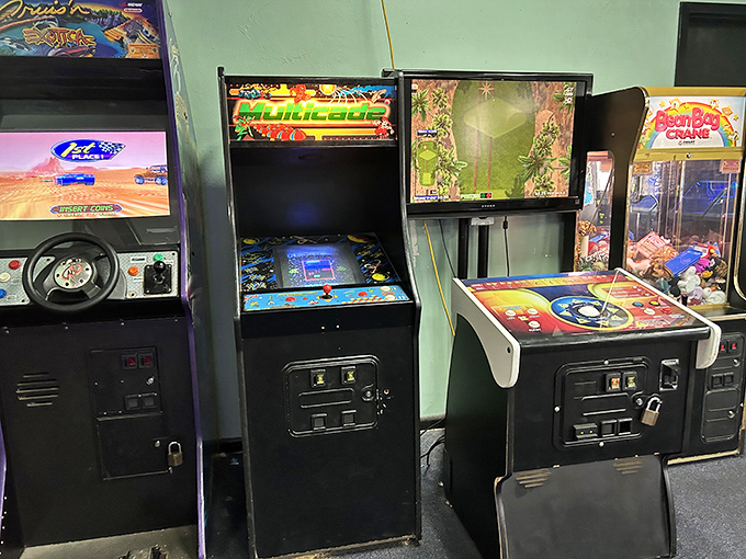 Vintage arcade games stand ready to entertain between bites, a reminder that good restaurants feed more than just your stomach.