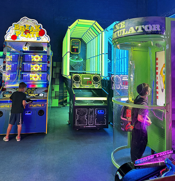 Modern arcade machines stand like sentinels of fun, their screens flashing with the promise of high scores and bragging rights.