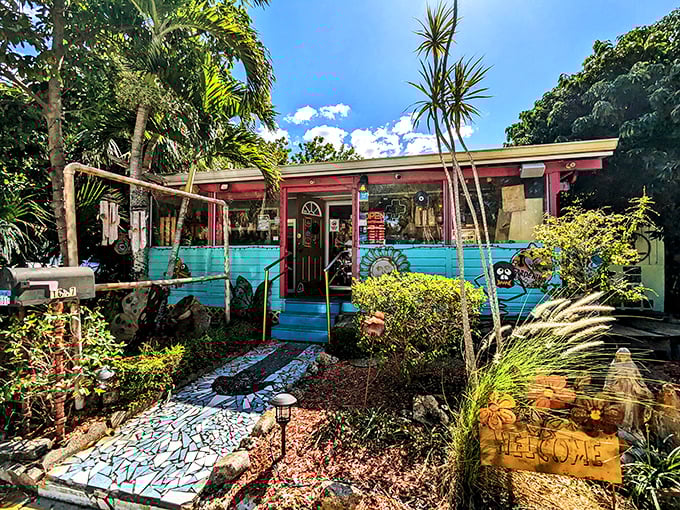 Tropical plants frame this artistic haven &ndash; where even the welcome mat seems to whisper "creativity lives here."