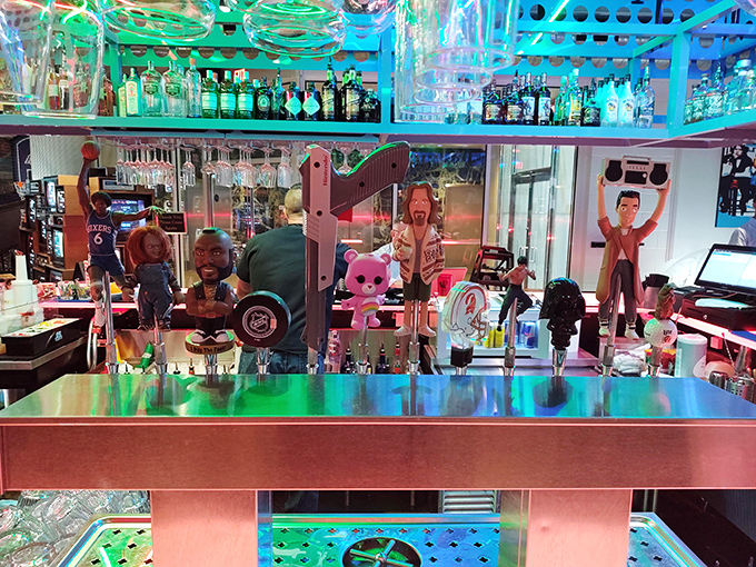 Collectible figurines stand guard along the bar, watching over an impressive array of spirits and specialty cocktails.