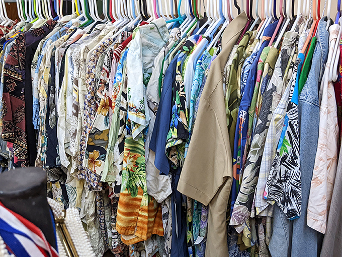 The vintage clothing section offers a rainbow of Hawaiian shirts and summer fashions, each garment a time capsule of vacation memories and bygone style.
