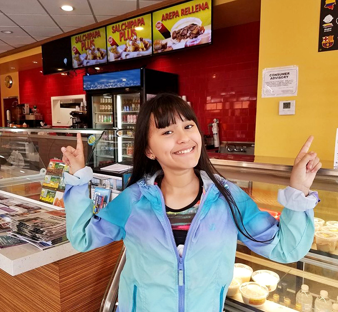 The universal language of food joy needs no translation&mdash;this customer's smile says everything about what awaits inside.