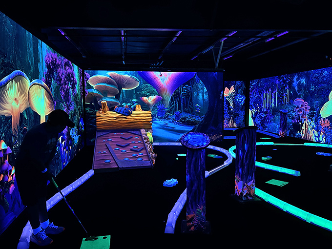 The glow-in-the-dark mini-golf creates a psychedelic putting paradise where even the worst golfers look cool under ultraviolet lighting.