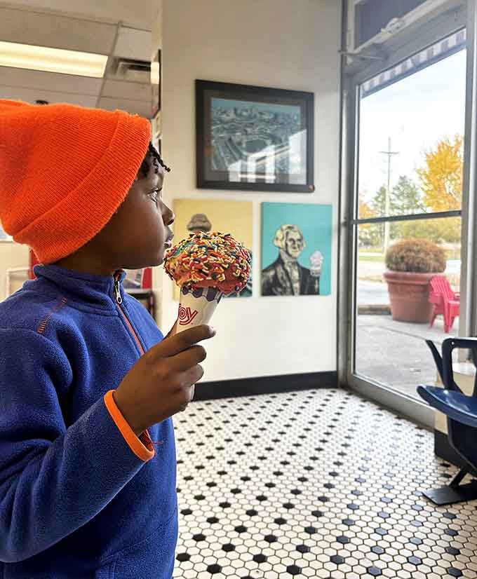 The look of pure concentration as this young connoisseur contemplates his sprinkle-covered masterpiece reminds us that ice cream appreciation starts early in Michigan.