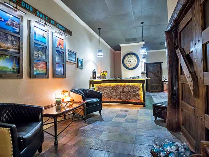 The lounge area welcomes visitors with leather chairs and ambient lighting that makes everyone look like they've just returned from vacation.