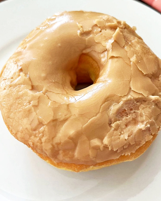 The maple donut &ndash; wearing its glaze like a satin jacket, ready to transport you to breakfast nirvana with one bite.
