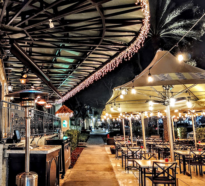 As evening falls, the outdoor seating area transforms into a twinkling oasis – Florida's version of an Italian piazza experience.