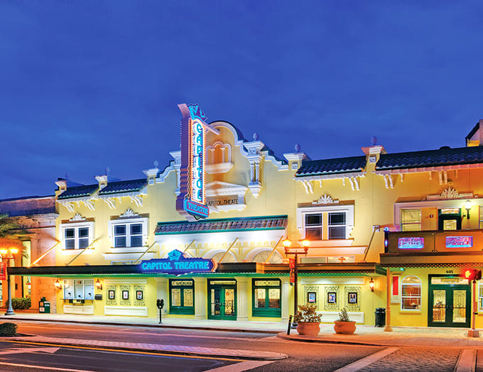 Bathed in golden light, the theater's exterior showcases the Mediterranean Revival architecture that has charmed visitors for decades.