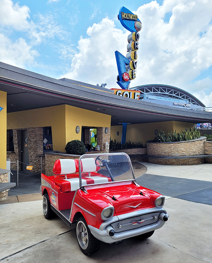 This classic car installation captures the nostalgic drive-in movie experience that inspired the entire attraction's delightfully retro concept.