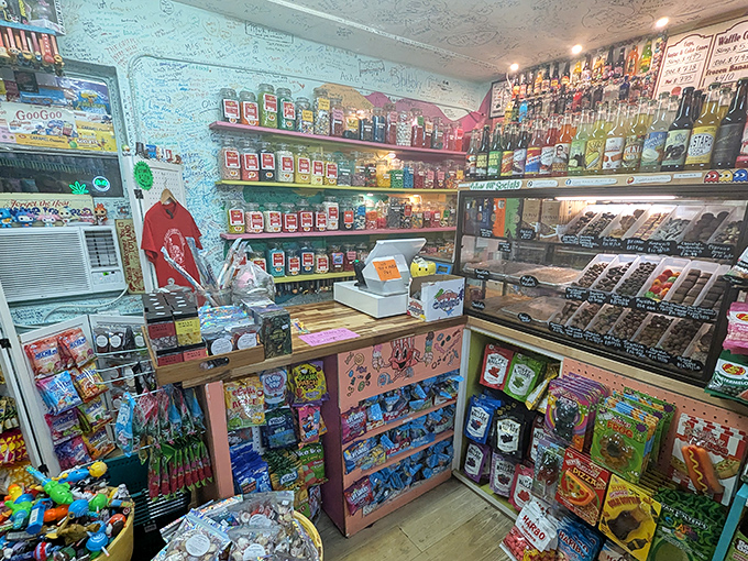 Every surface tells a story at the register area, where decades of visitor signatures create a guest book written in memories and sugar rushes.