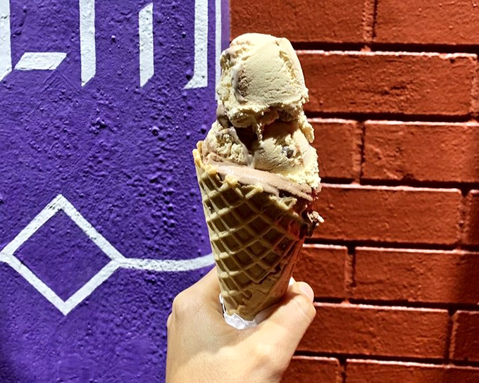 This cone of rocky road ice cream isn't just dessert &ndash; it's an expedition through chocolate terrain with marshmallow landmarks.