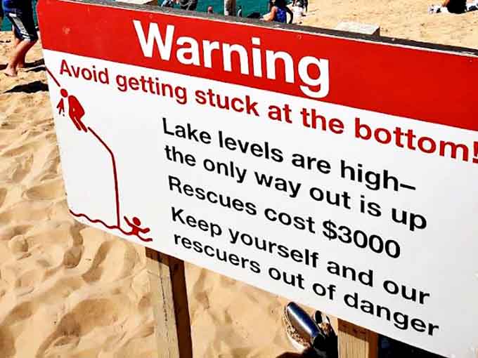 This warning sign isn't kidding around, because getting rescued from a dune costs more than most people's monthly car payments.