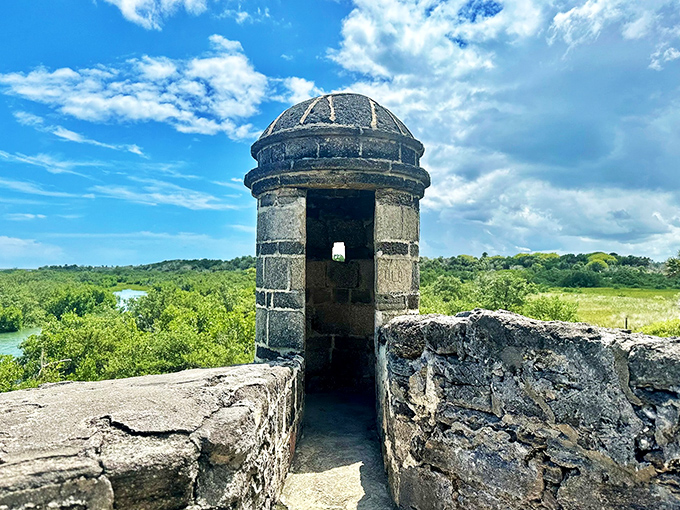 The stone sentry tower stands as a silent witness to centuries of coastal drama, from colonial conflicts to tourist selfies.