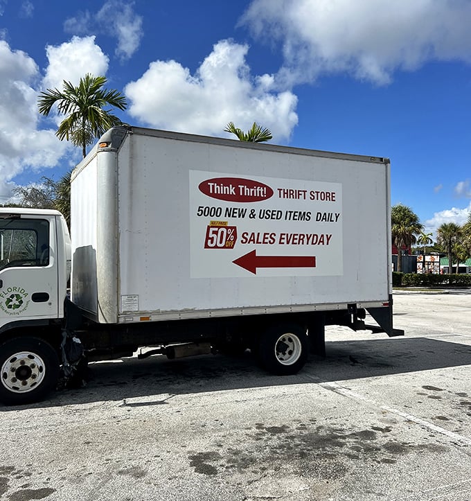 The delivery truck promises "5000 NEW & USED ITEMS DAILY" – a rolling treasure chest ensuring the store's inventory stays fresh and surprising.