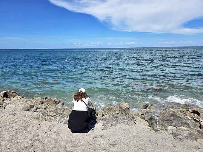 Finding quiet contemplation where land meets sea. The preserve offers peaceful moments of connection with Florida's ancient coastal landscape.