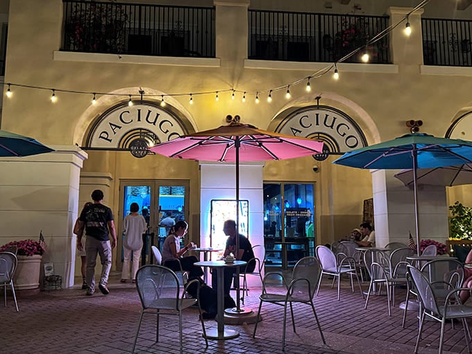 Paciugo's elegant evening ambiance, with colorful umbrellas and soft lighting, creates a perfect gelato destination.