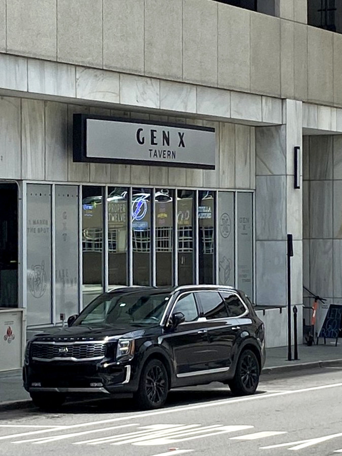 The sleek entrance to GenX Tavern welcomes those looking to revisit their youth through food, drinks, and retro entertainment.