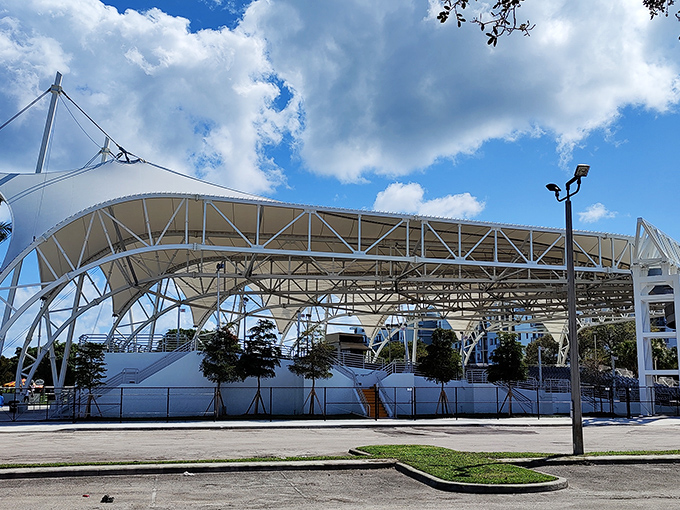 The Amphitheater under evening skies becomes Pompano's living room, where music and laughter blend with ocean breezes in perfect harmony.