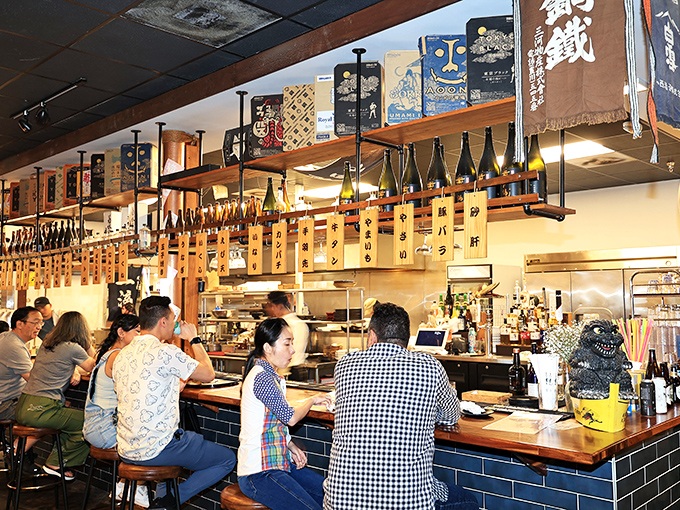 The bar mixes warm wood and vibrant d&eacute;cor, offering drinks to pair with flavorful comfort dishes.