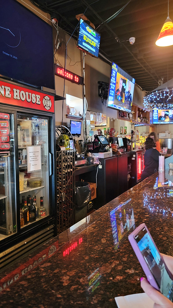 The bar area buzzes with energy, where locals and visitors alike gather to share stories over cold Michigan brews.