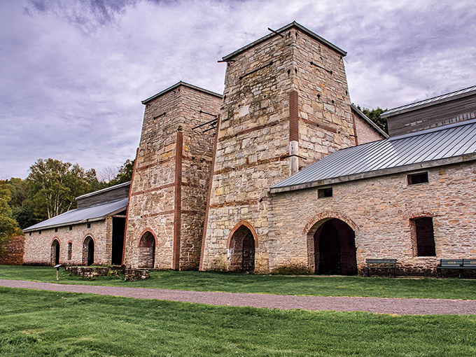 The blast furnaces rise like industrial cathedrals, their arched openings reminiscent of church windows that worshipped iron instead of deities.