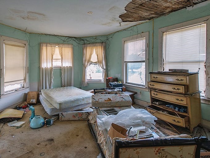 Mattresses and drawers abandoned mid-move tell a story of hasty departure, leaving behind questions that walls can't answer.