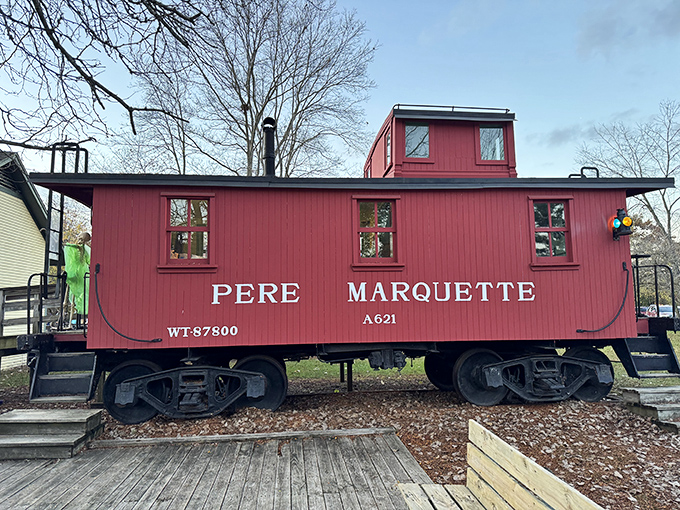 This Pere Marquette caboose, painted in signature red, once housed the crew who watched over freight trains as they rumbled across Michigan.