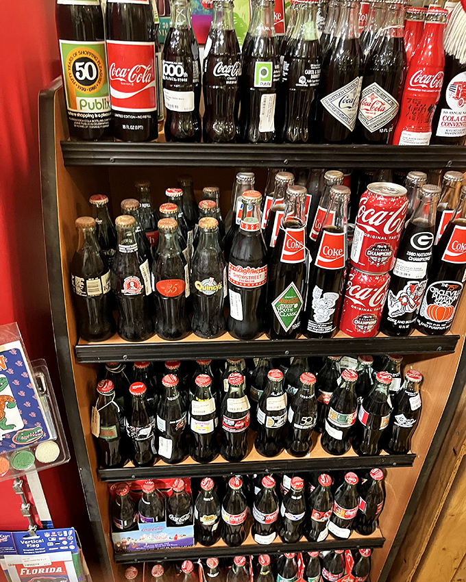 Coca-Cola bottles stand in formation like fizzy soldiers, each commemorative edition capturing a moment in American pop culture history.