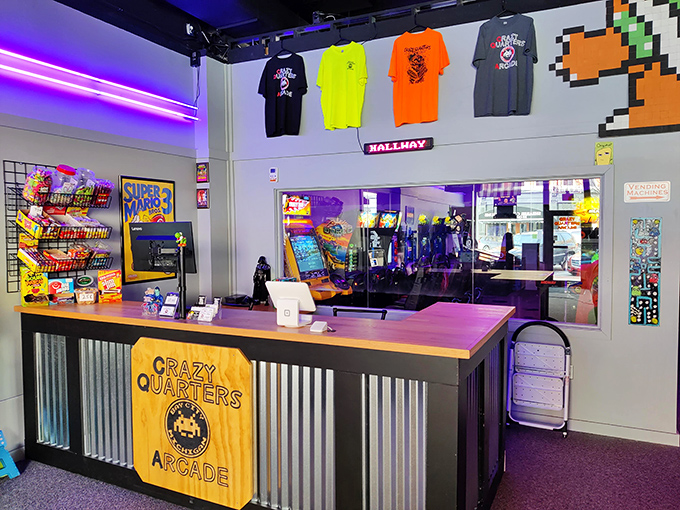 The welcoming front counter at Crazy Quarters, where gaming dreams begin with a simple transaction and friendly staff ready to guide your arcade adventure.
