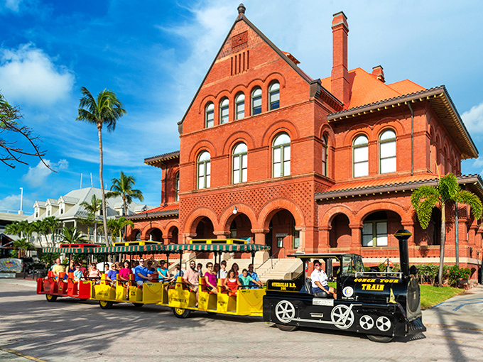 The stately red brick courthouse stands as a testament to Key West's importance, while the train carries on its storytelling mission.