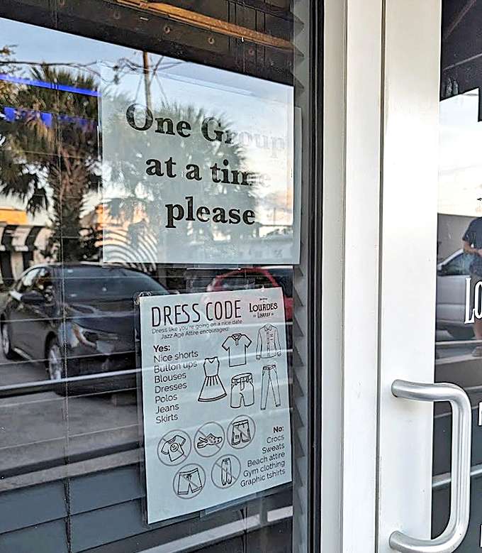 The dress code and entry instructions maintain the speakeasy's refined atmosphere &ndash; no beach attire allowed in this literary sanctuary.