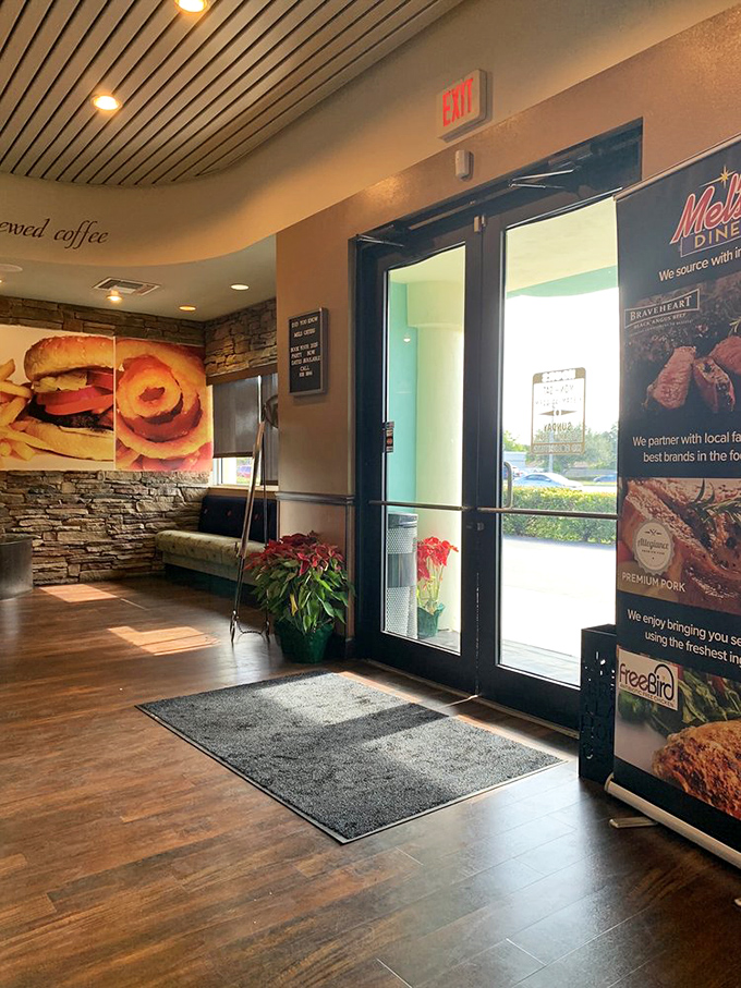 Mel's entrance welcomes hungry visitors with promises of freshly brewed coffee and hearty meals, the threshold between ordinary day and extraordinary dining.