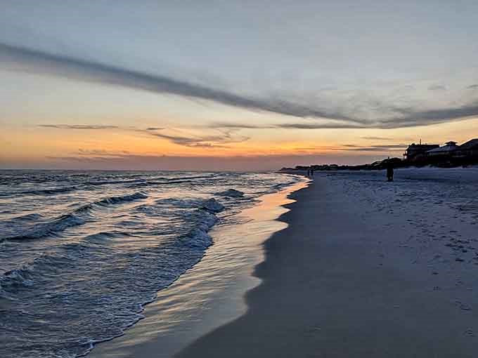 Sunset paints the shoreline in golden hues, transforming an already beautiful beach into something truly magical.