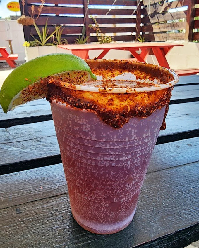 A frosty purple concoction rimmed with chili-lime seasoning &ndash; part drink, part appetizer, and entirely responsible for many spontaneous weekend decisions.