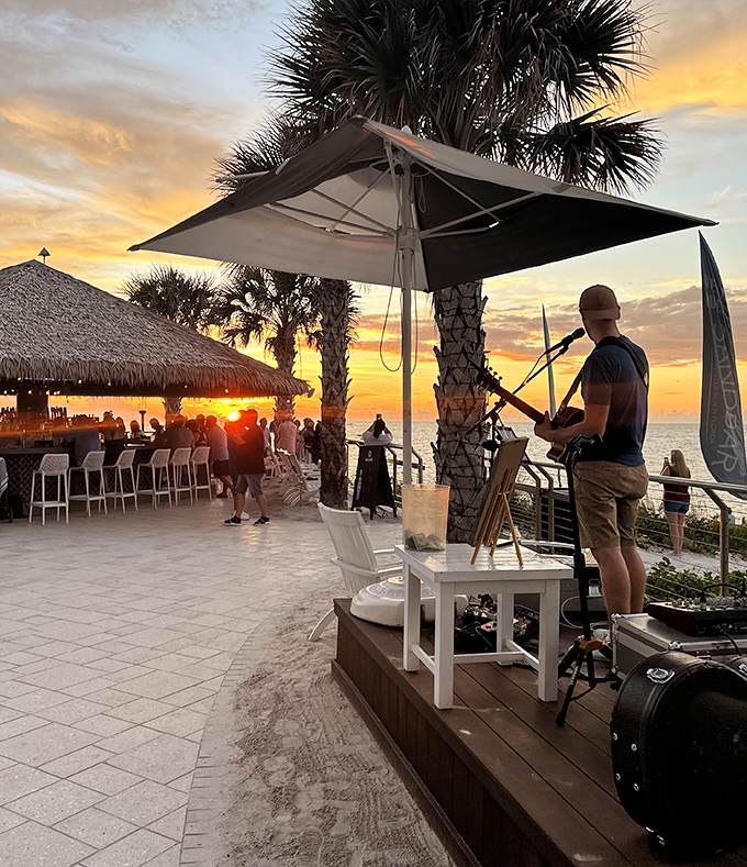 Sunset serenades: Local musicians provide the soundtrack while nature handles the spectacular backdrop light show.