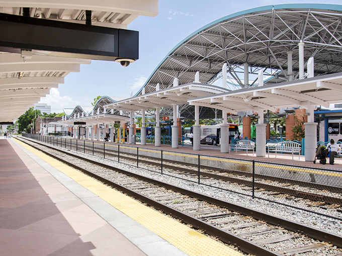 The curved canopy of this modern transit hub provides welcome shade for waiting passengers while adding architectural interest to the urban landscape.