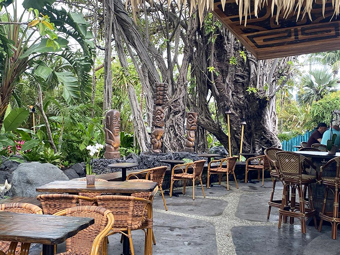 The outdoor seating area, complete with authentic tiki statues, offers the perfect backdrop for pretending you're on vacation even if you live ten minutes away.
