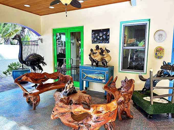 This wooden bench carved from what appears to be a single massive tree trunk curves like water frozen in time—seating that makes you reconsider your relationship with your boring living room couch.