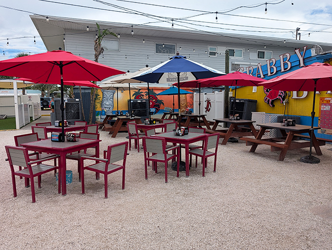 The outdoor patio where magic happens at sunset, with string lights creating ambiance as perfect as the Gulf breeze.