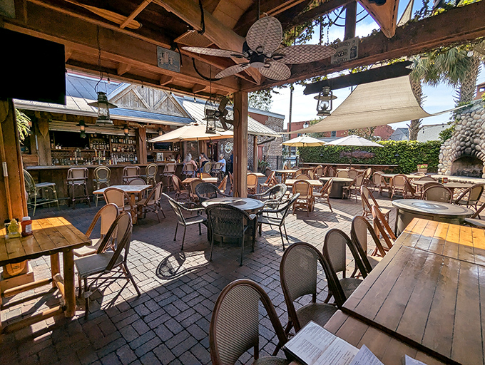 The outdoor patio offers al fresco dining under string lights, where Florida evenings become the perfect backdrop for memorable meals.